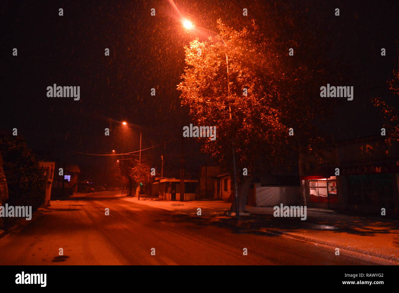Snowing at night Stock Photo - Alamy
