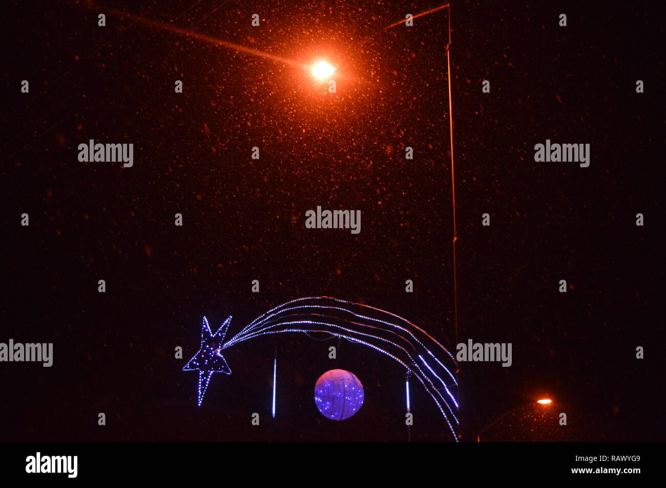 Snowing at night Stock Photo - Alamy
