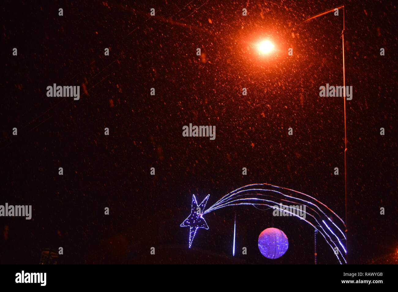 Snowing at night Stock Photo - Alamy