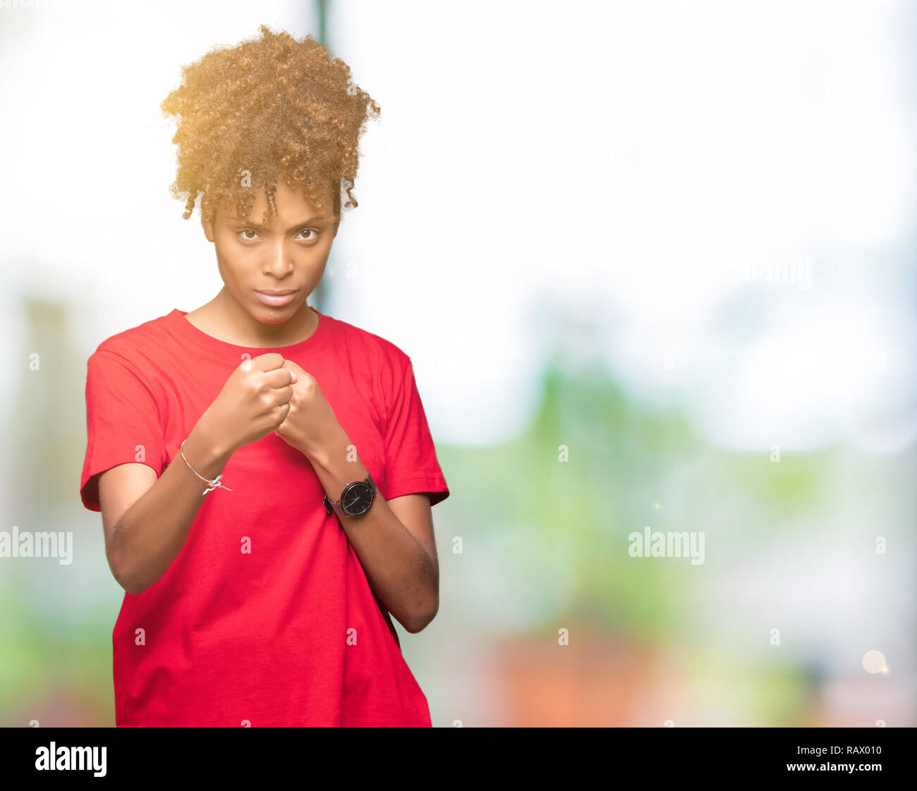 Beautiful young african american woman over isolated background Ready ...