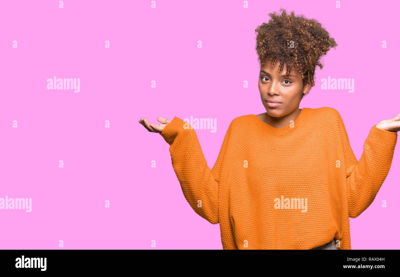 Beautiful young african american woman over isolated background ...