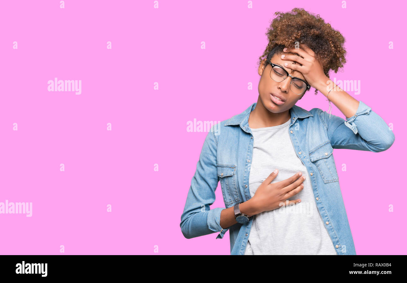 Beautiful young african american woman wearing glasses over isolated ...