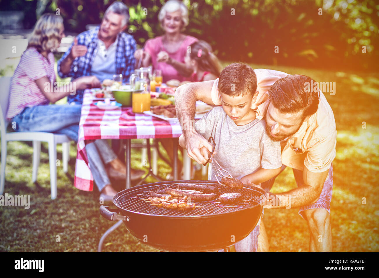 Family mother father grill hi-res stock photography and images - Alamy