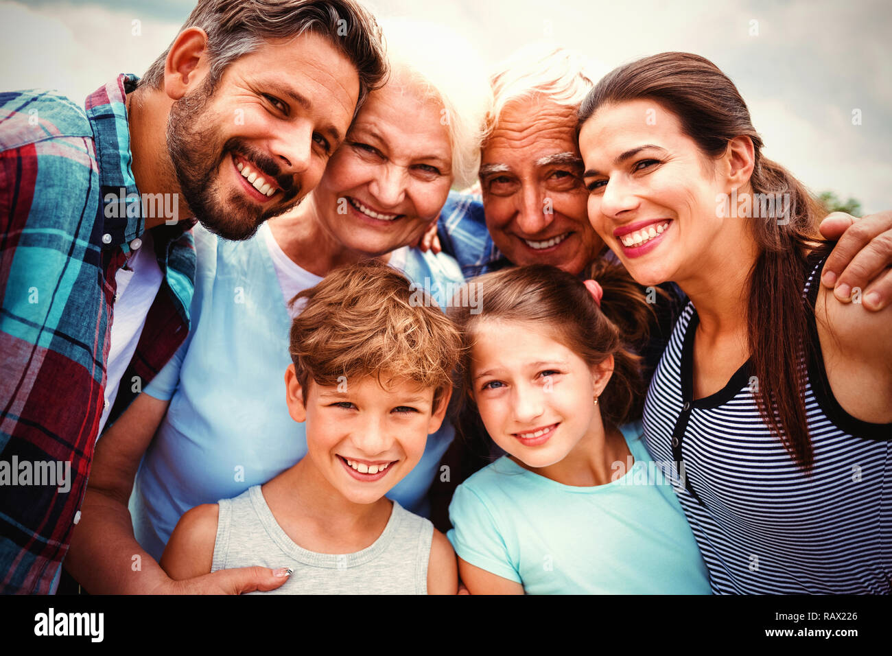 Grandfather father and son smiling against blurred background at the ...