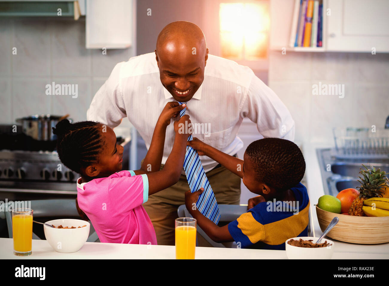 Boy helping father tie tie hi-res stock photography and images - Alamy