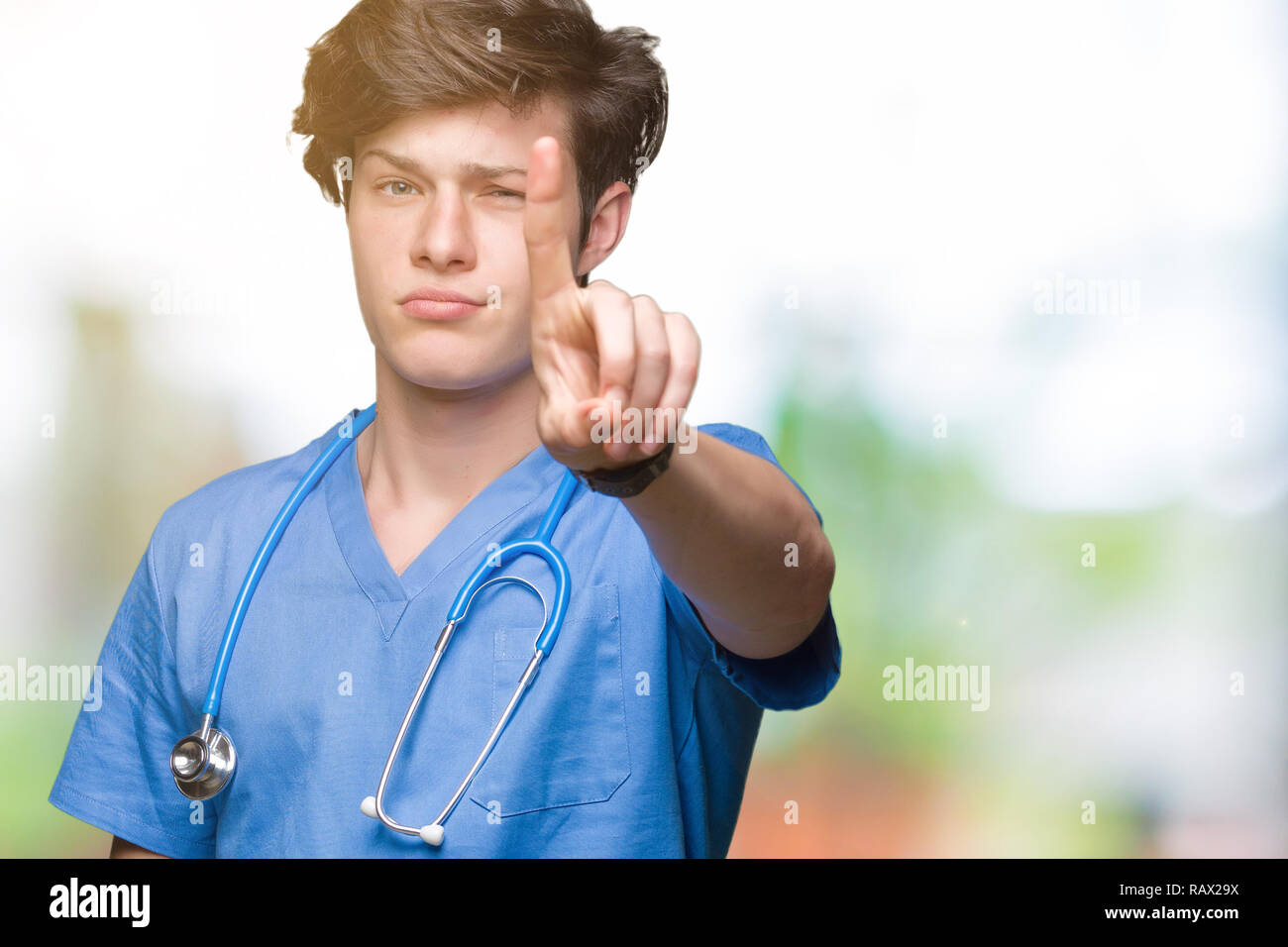Young doctor wearing medical uniform over isolated background Pointing ...