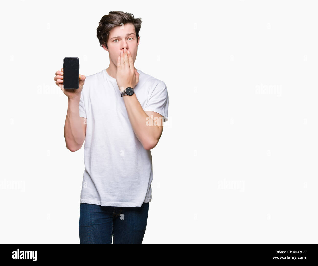Young man showing smartphone screen over isolated background cover ...