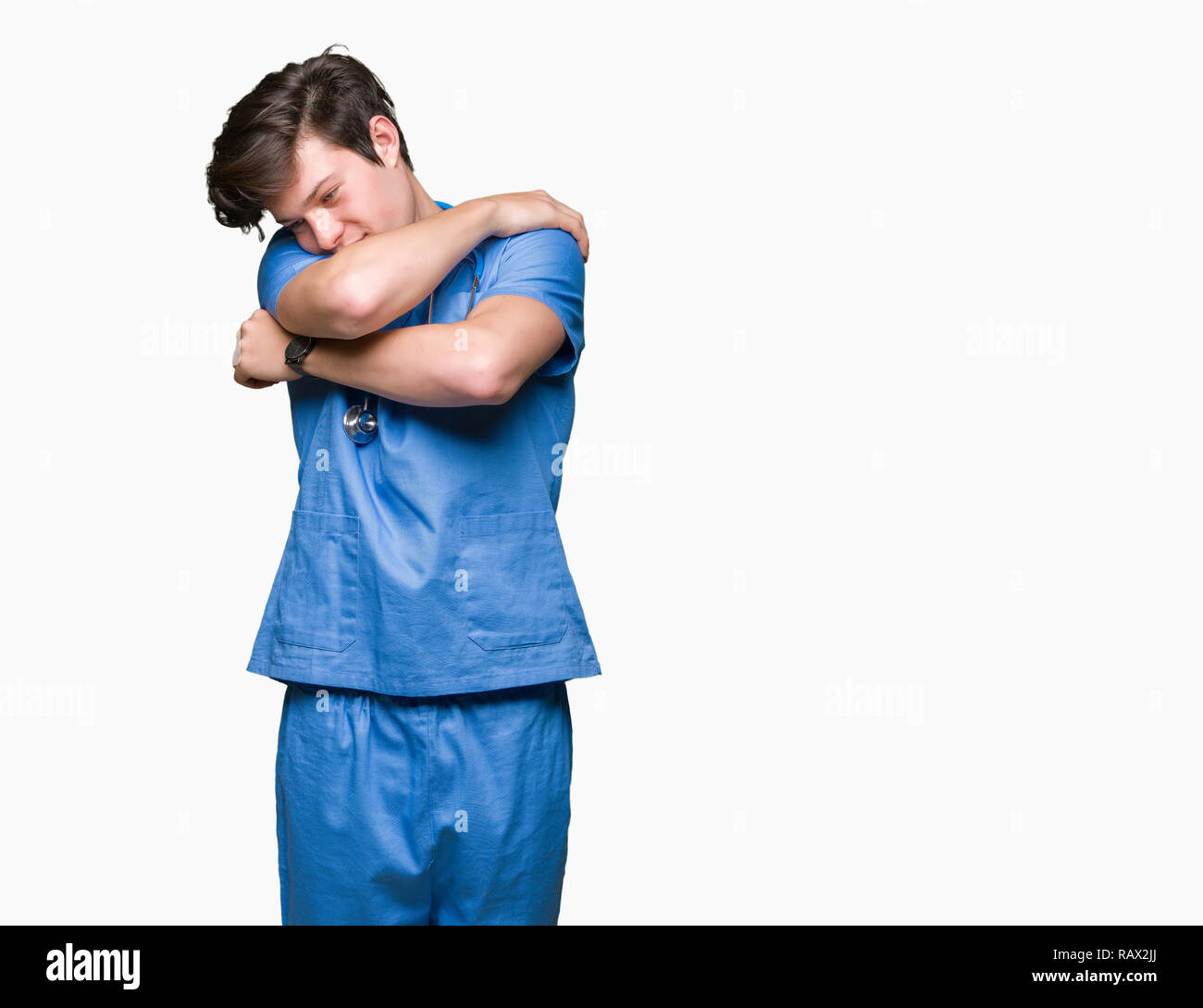 Young doctor wearing medical uniform over isolated background Hugging ...