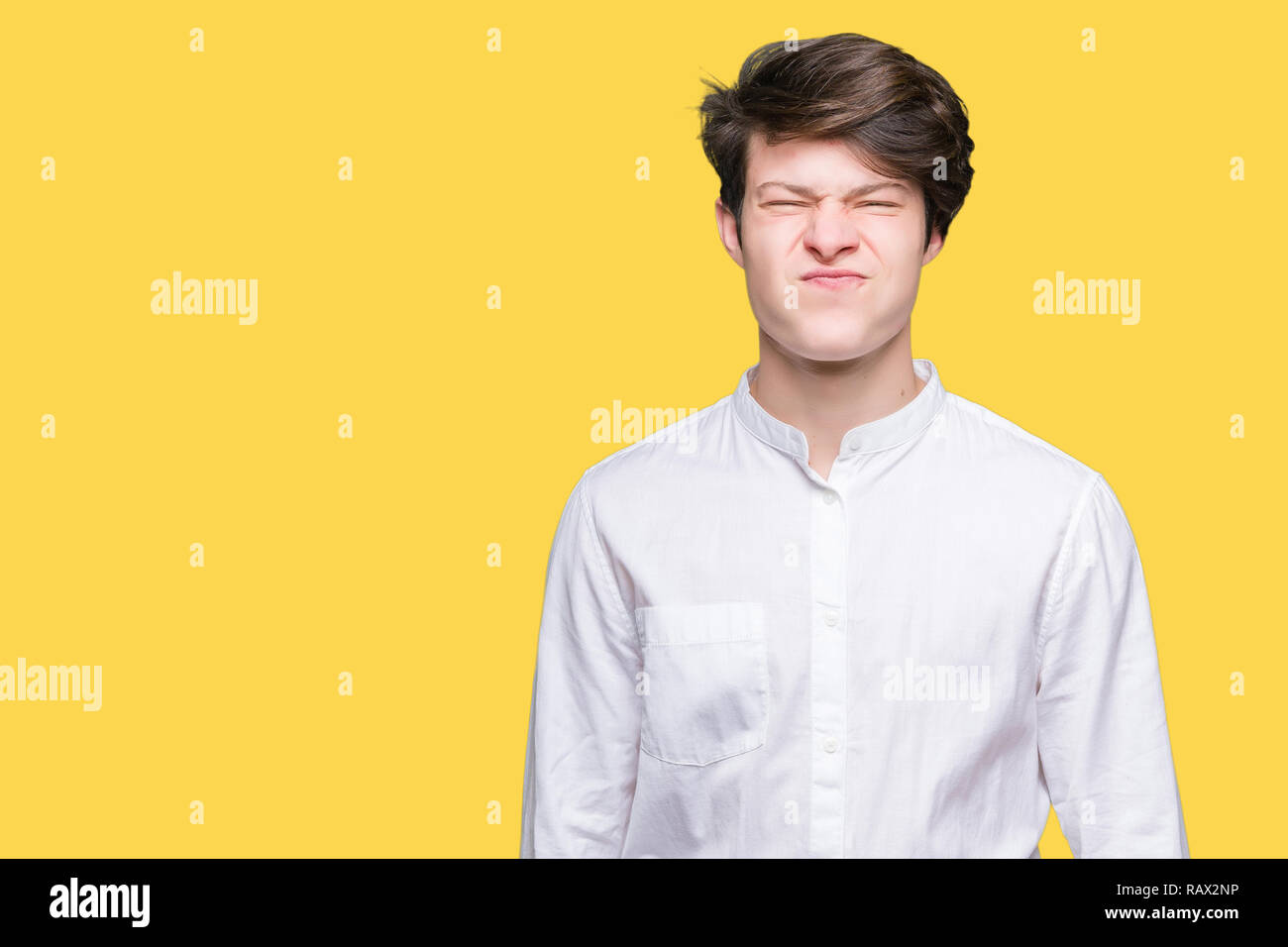 Young handsome business man over isolated background puffing cheeks ...