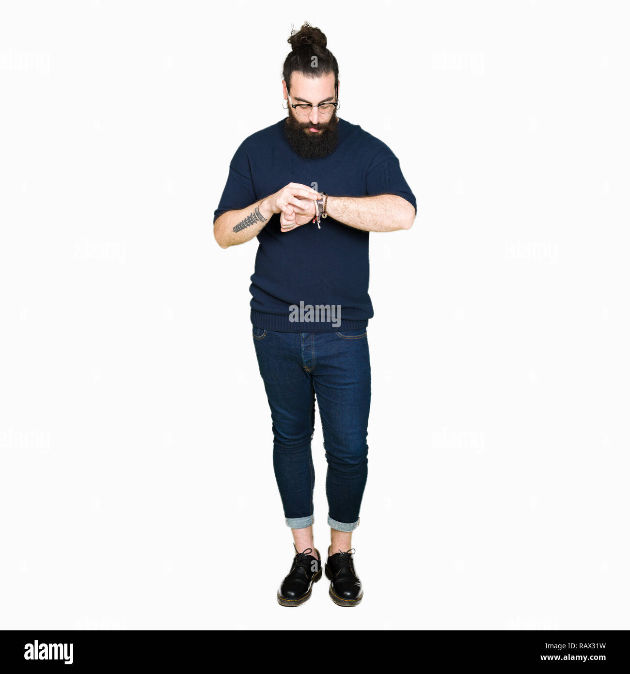 Young man checking hair Cut Out Stock Images & Pictures - Alamy