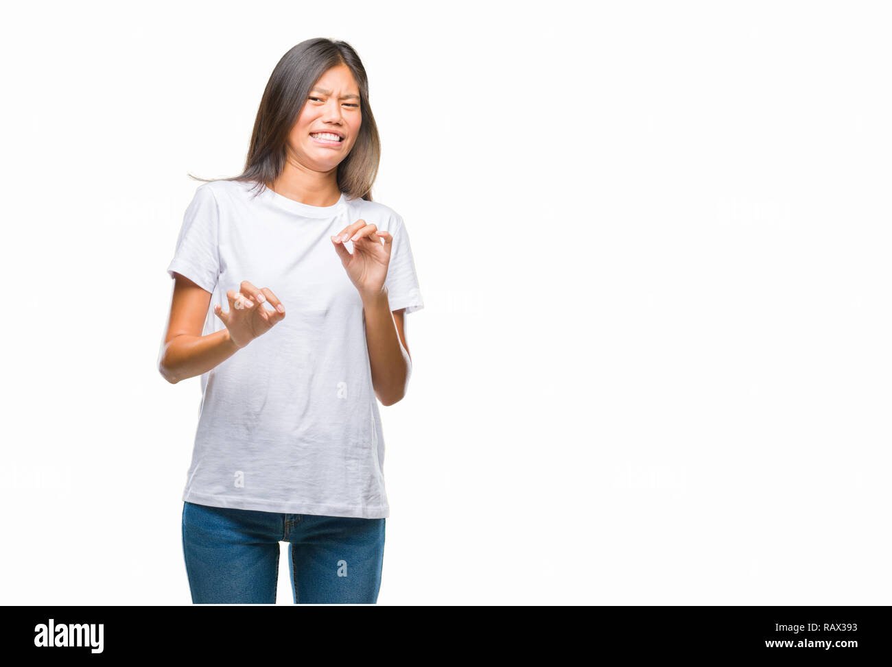 Young asian woman over isolated background disgusted expression ...