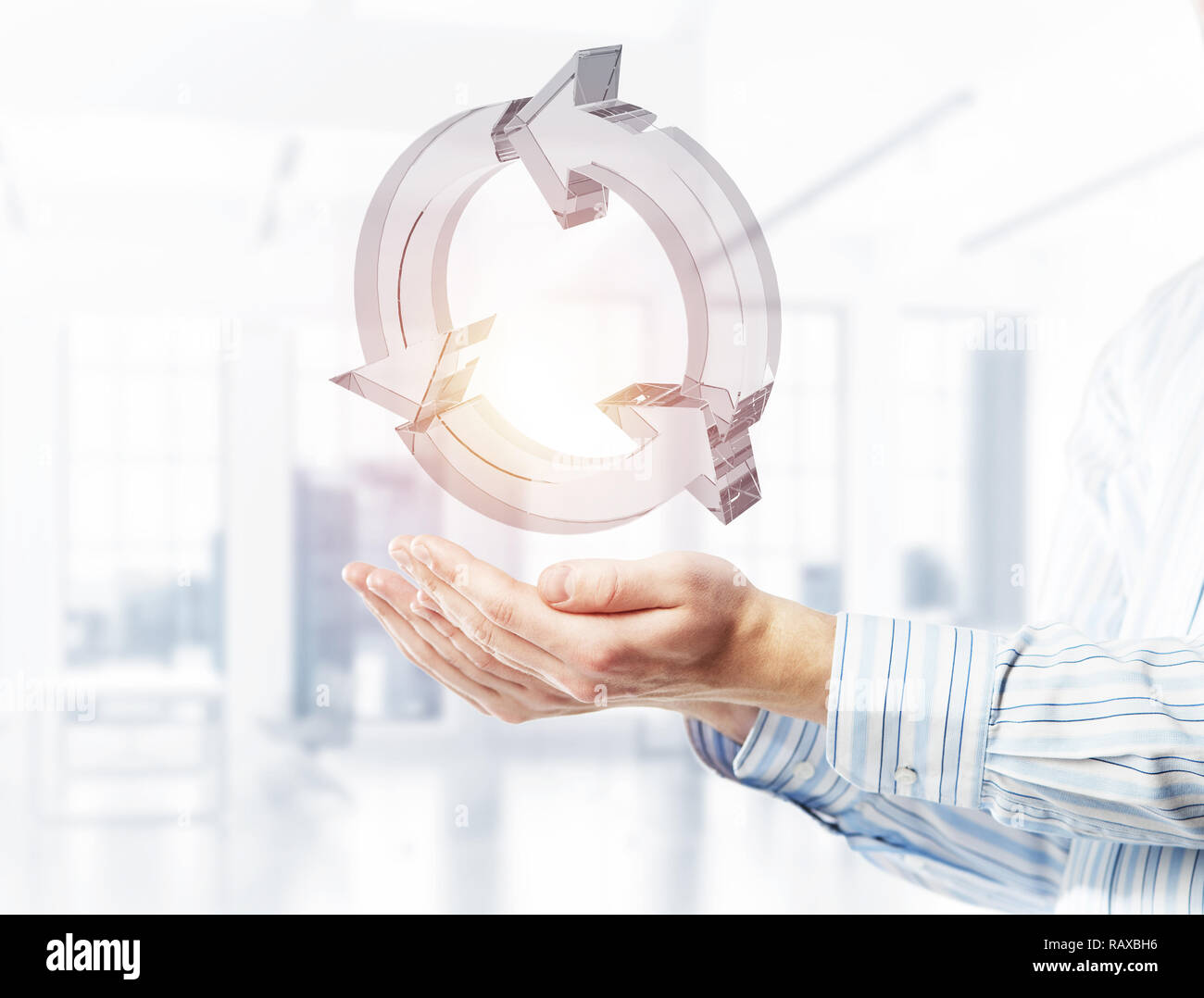 Web refresh icon in male hands as symbol for internet use. Mixed Stock ...