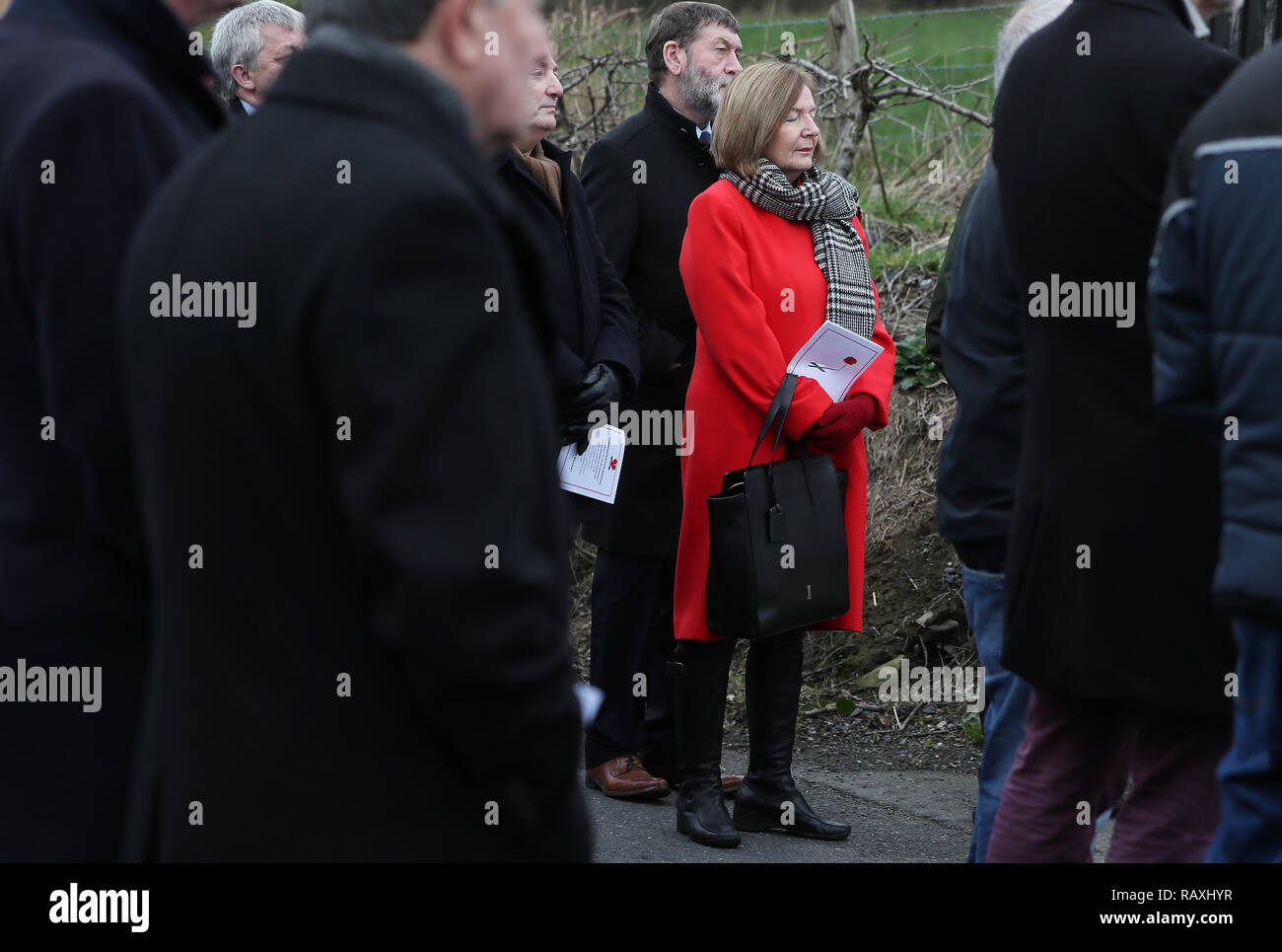 People attend a roadside service on Kingsmill road marking the 43rd ...