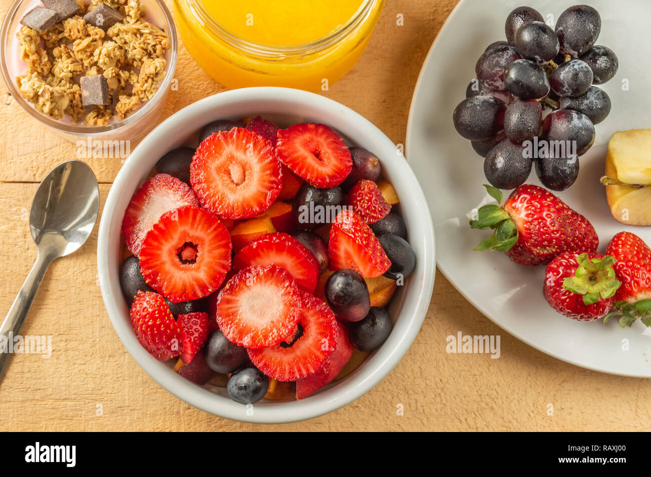 Flat Layout of a breakfast table with fruit salad, orange juice and ...