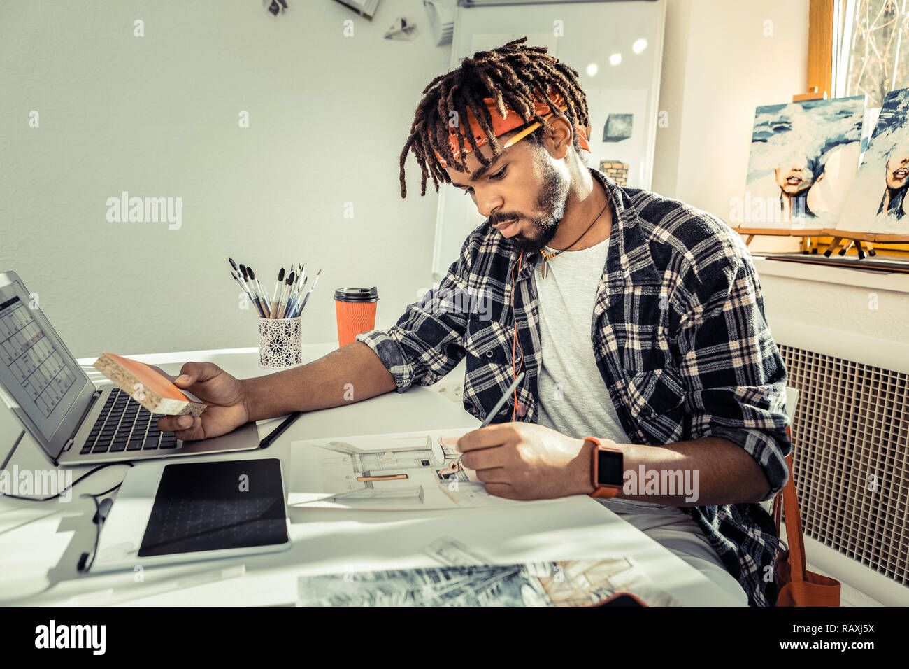 Professional prosperous interior designer working on serious project ...