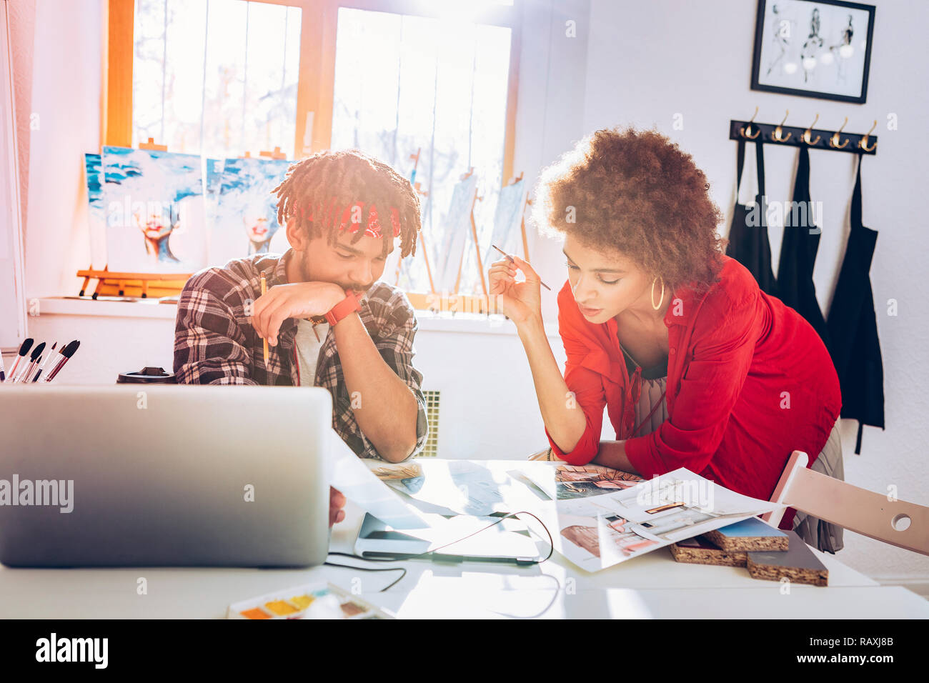 Couple of interior designers feeling excited having serious project ...