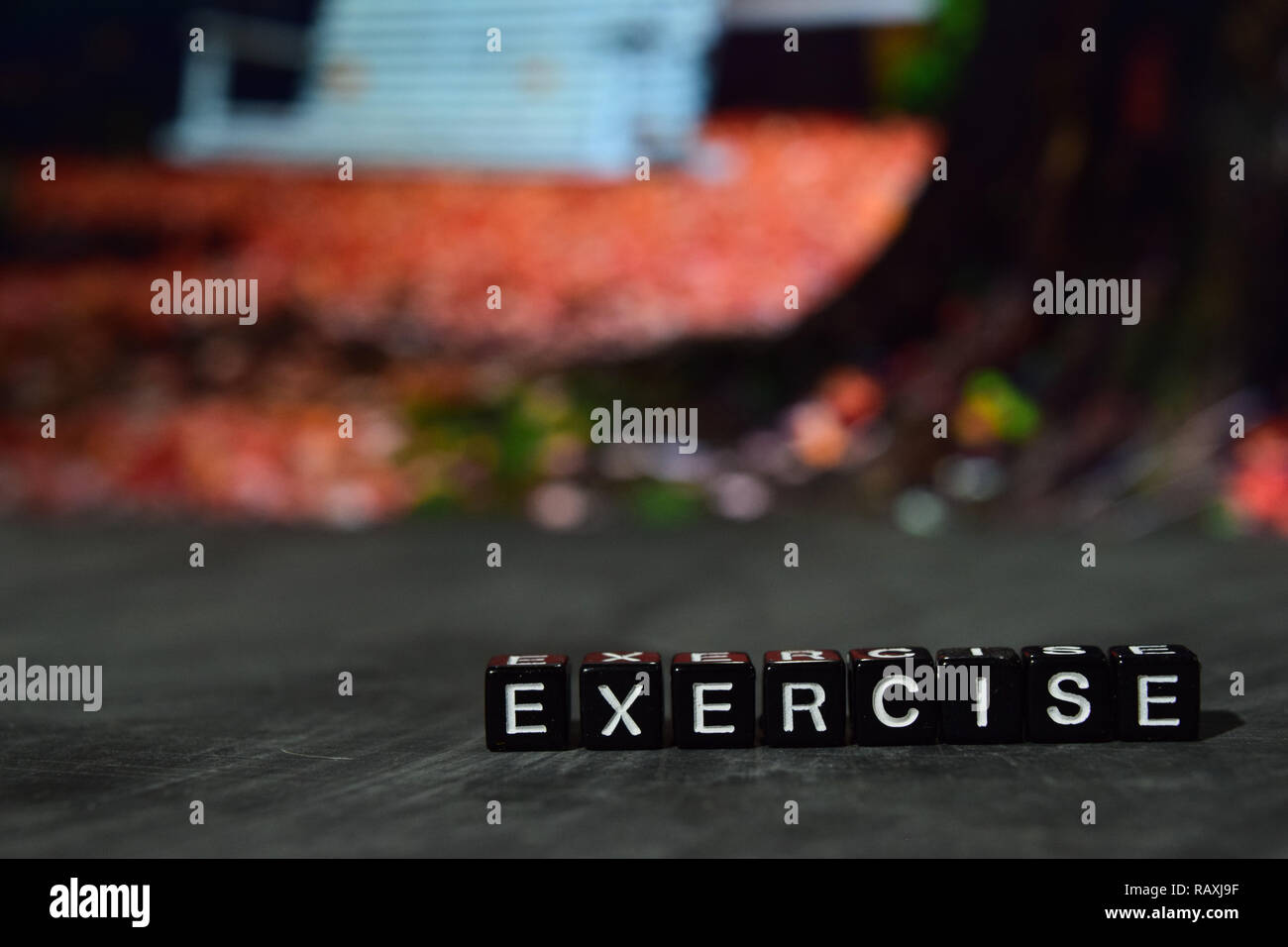 Exercise on wooden blocks. Cross processed image with bokeh background ...