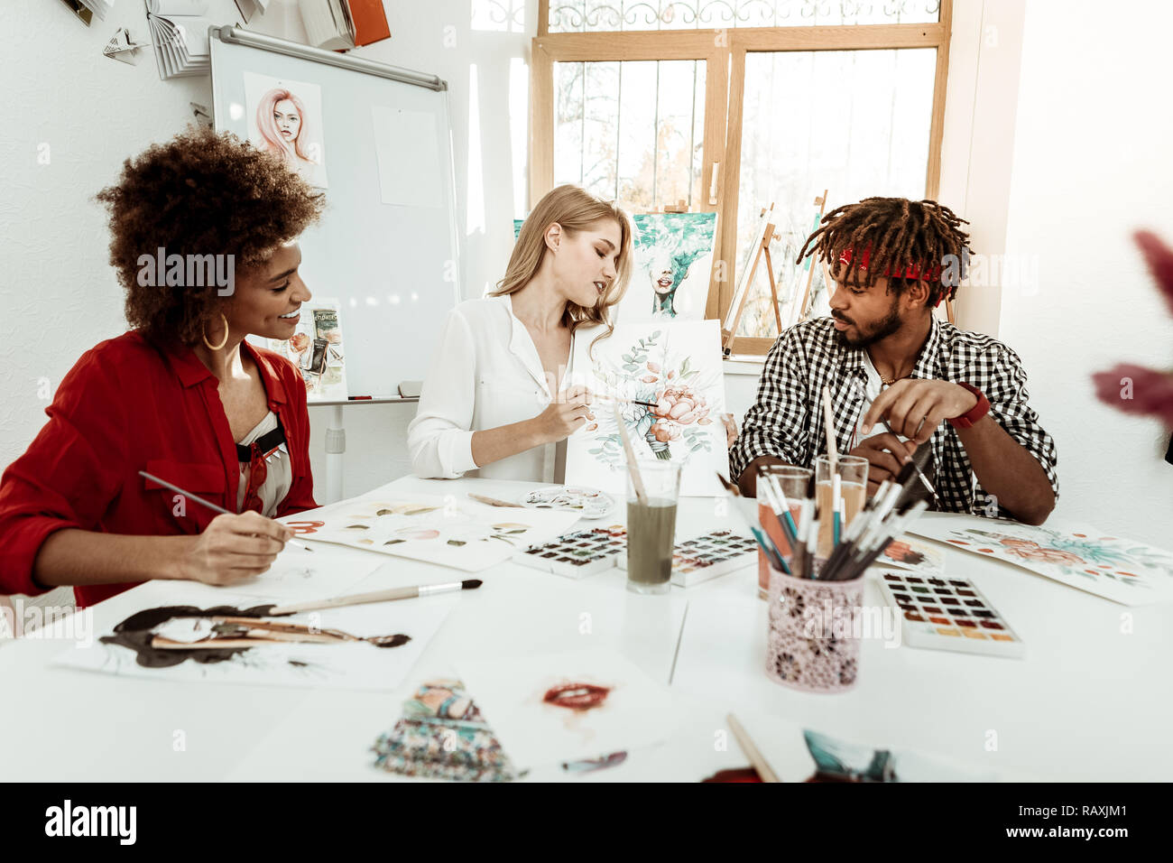Three young artists hi-res stock photography and images - Alamy