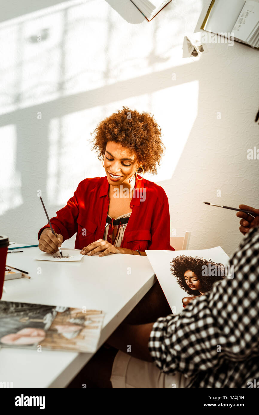 Appealing young artist drawing portrait of her boyfriend Stock Photo ...