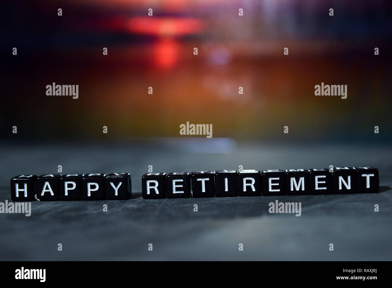 Happy retirement on wooden blocks. Cross processed image with bokeh ...