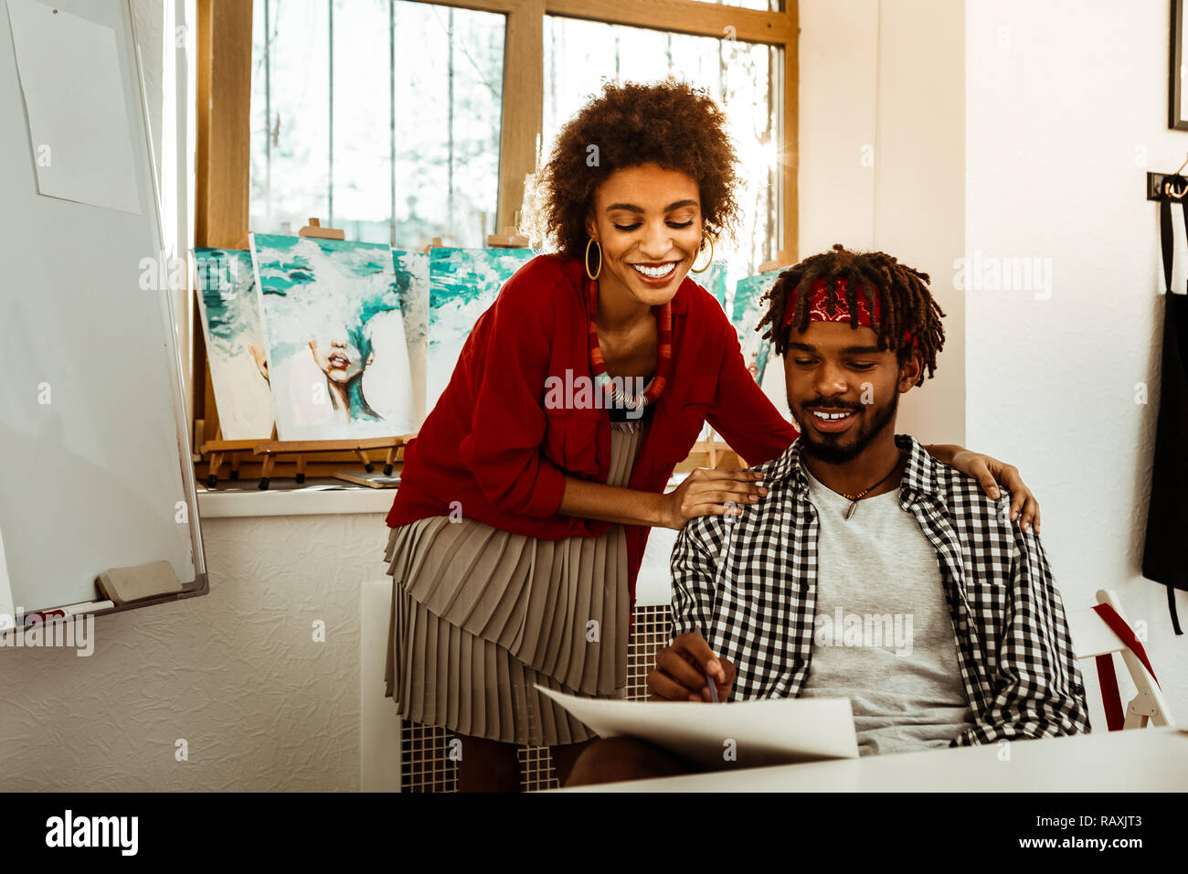 Beaming cheerful girlfriend standing near her man Stock Photo - Alamy Beaming cheerful girlfriend standing near her man Stock Photo - Alamy