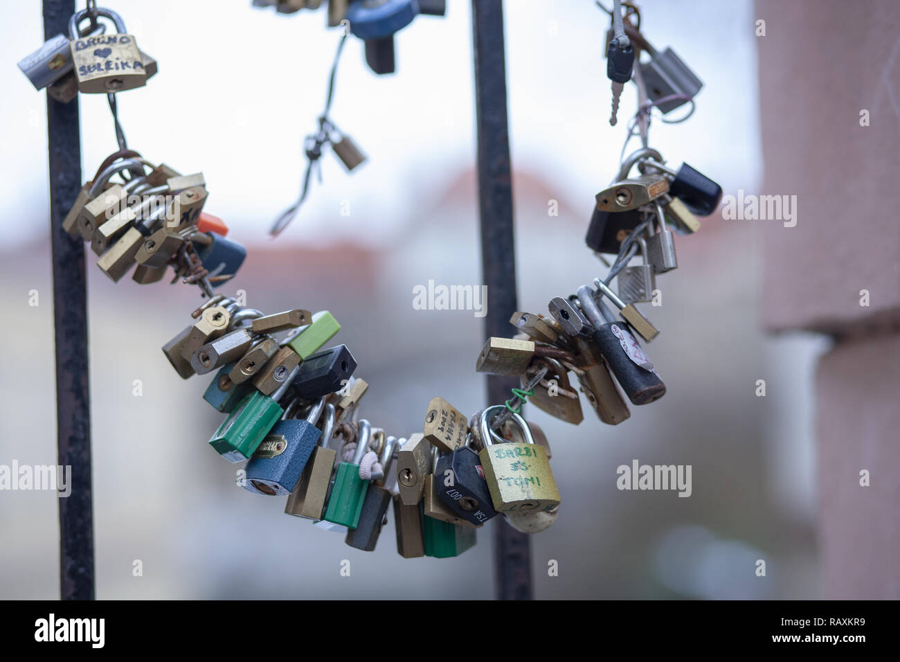 Love lock padlocks attached to the railings of Lovers Bridge in Prague ...