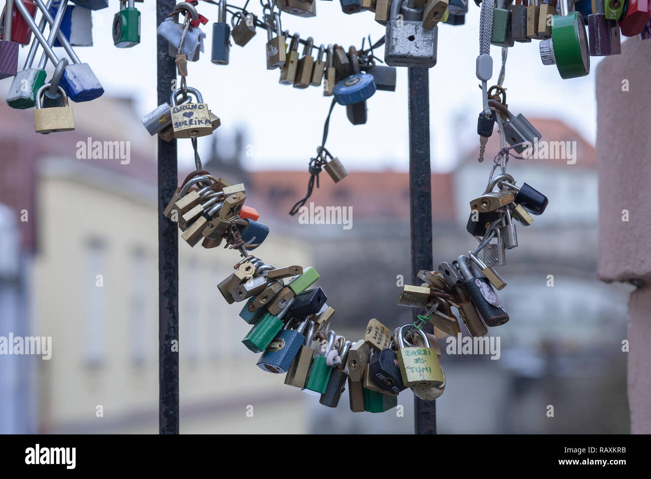 Love lock padlocks attached to the railings of Lovers Bridge in Prague ...
