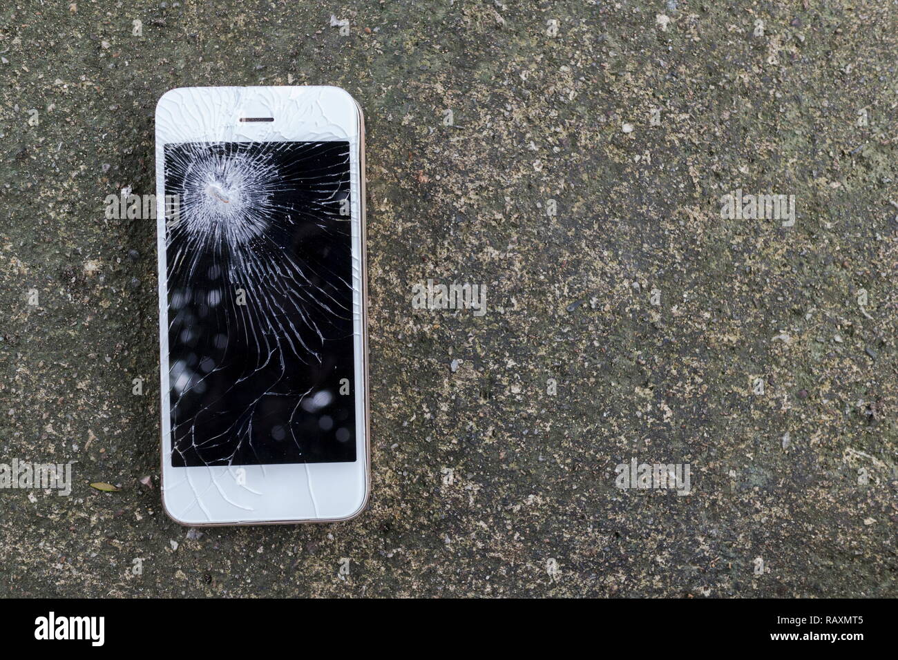 Smartphone mobile fall on the cement floor with touch screen broken ...