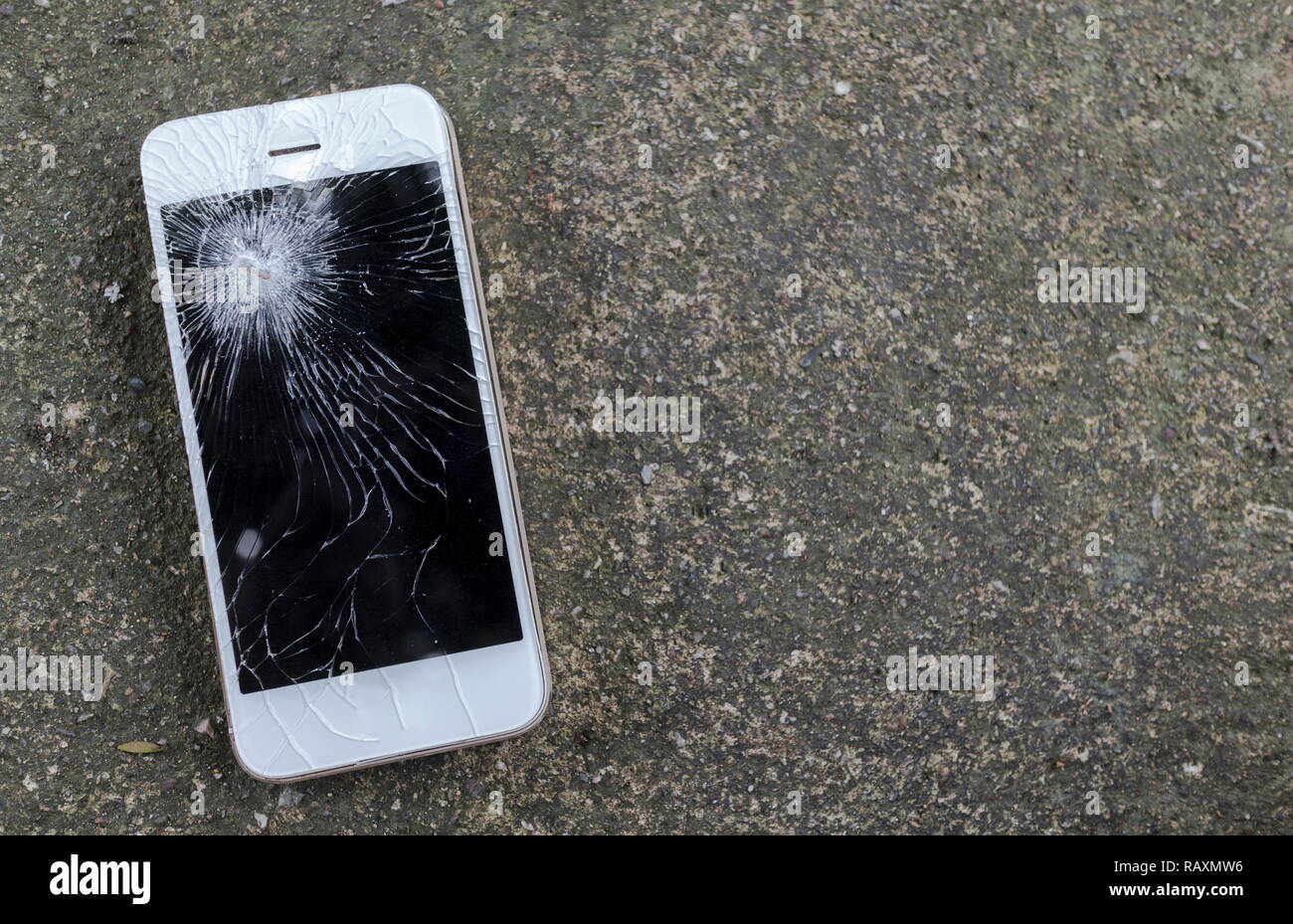Smartphone mobile fall on the cement floor with touch screen broken ...