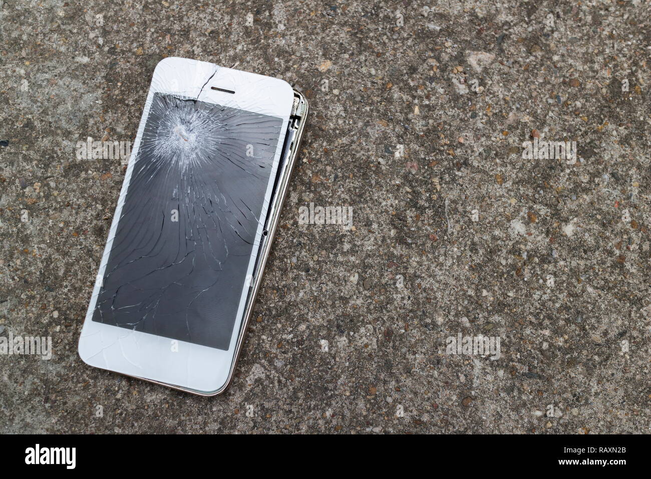 Smartphone mobile fall on the cement floor with touch screen broken ...
