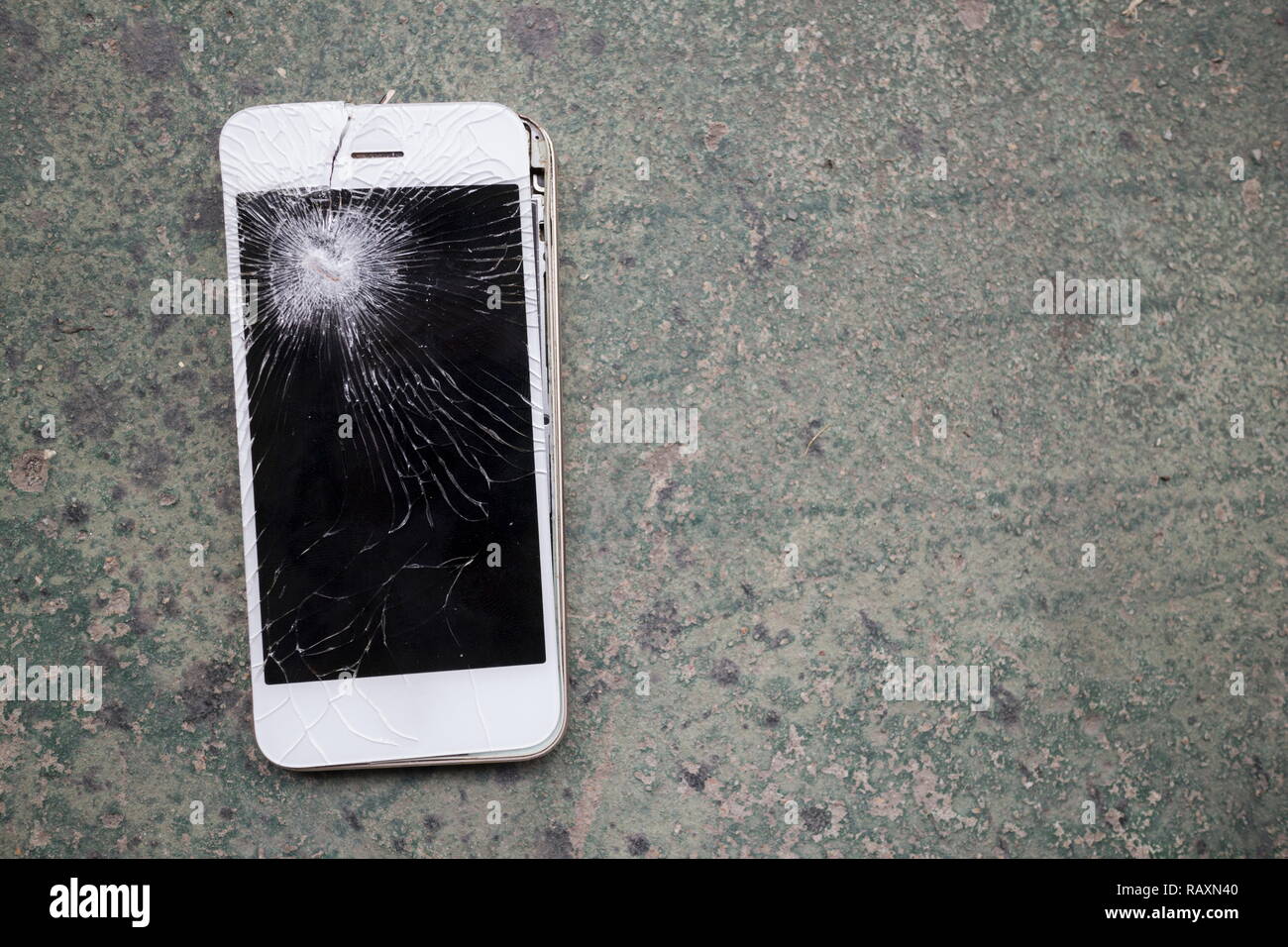 Smartphone mobile fall on the cement floor with touch screen broken ...