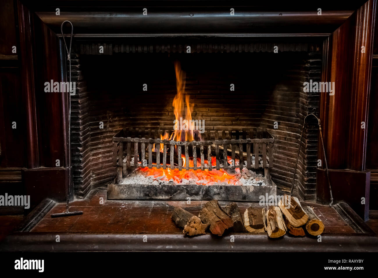 Burning logs in a Winter fireplace Stock Photo - Alamy