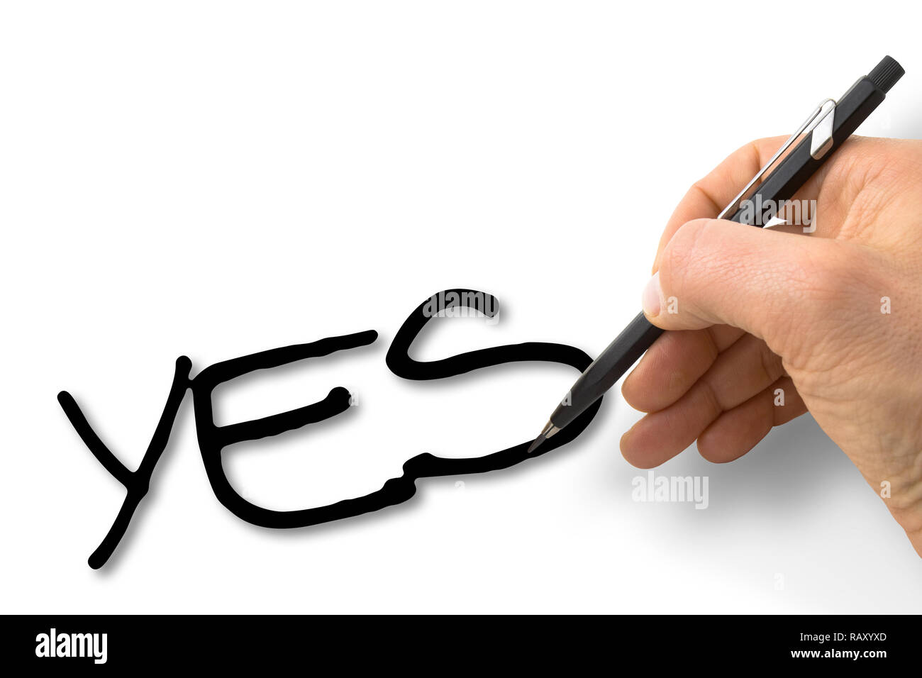 Male hand writing "yes" in capital letters on a blank card isolated on ...