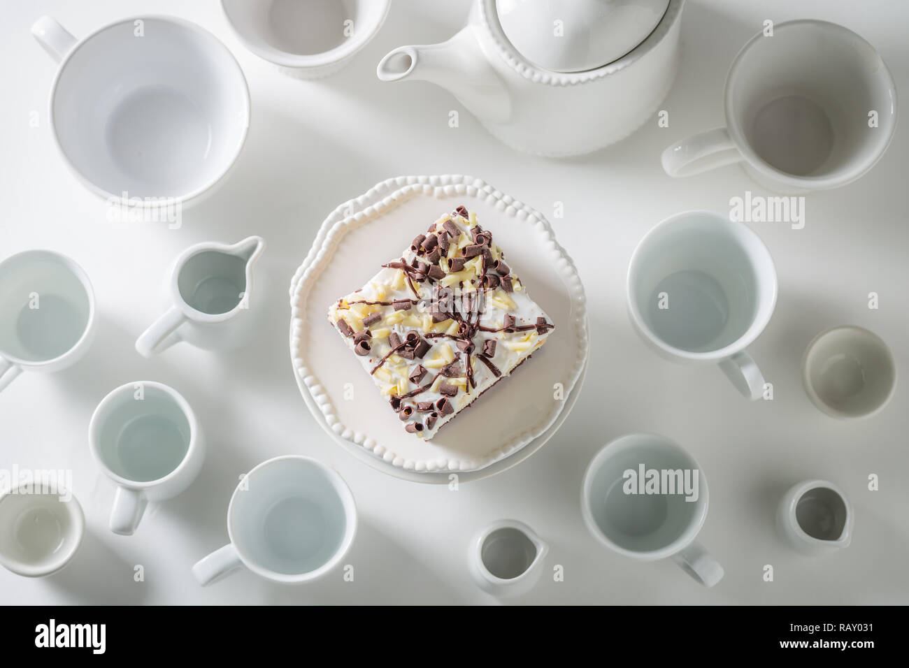 Top view of white cake with mousse, chocolate and porcelain Stock Photo ...