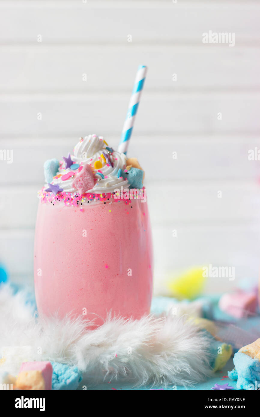 Pink Unicorn strawberry milkshake with whipped cream, sugar and ...