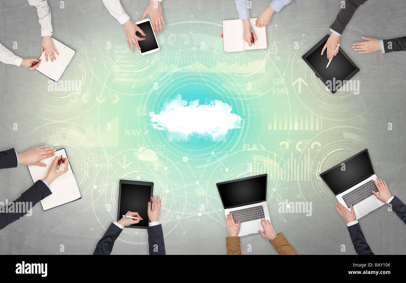 Group of people with devices in hands working on reports with online ...