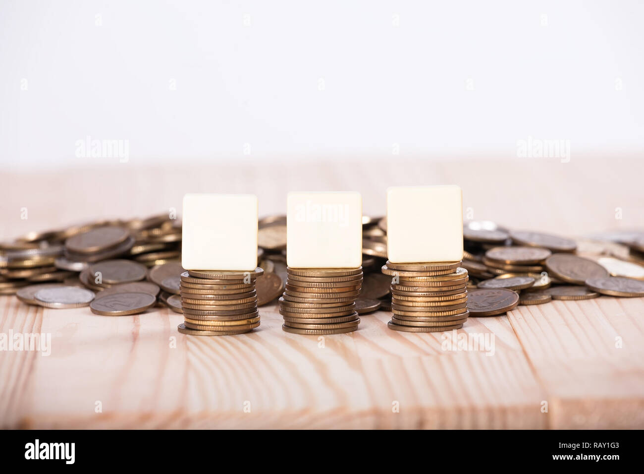 Generic blank tiles money coins light natural wooden background ...