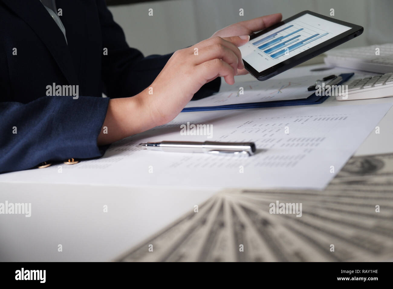 Women working in office. financial analysis with charts on pad for ...