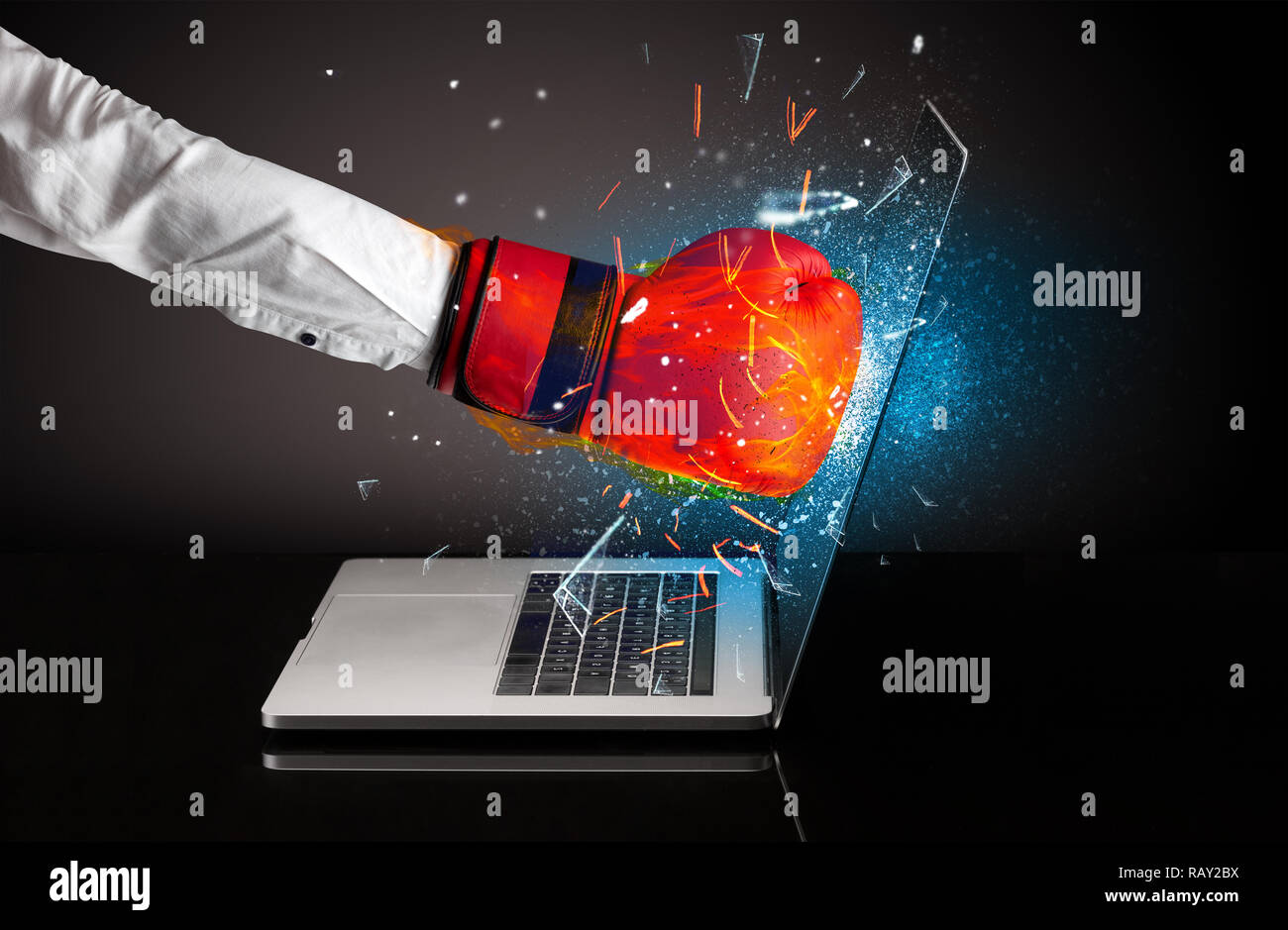 Firing hand hitting strongly laptop screen glass Stock Photo - Alamy