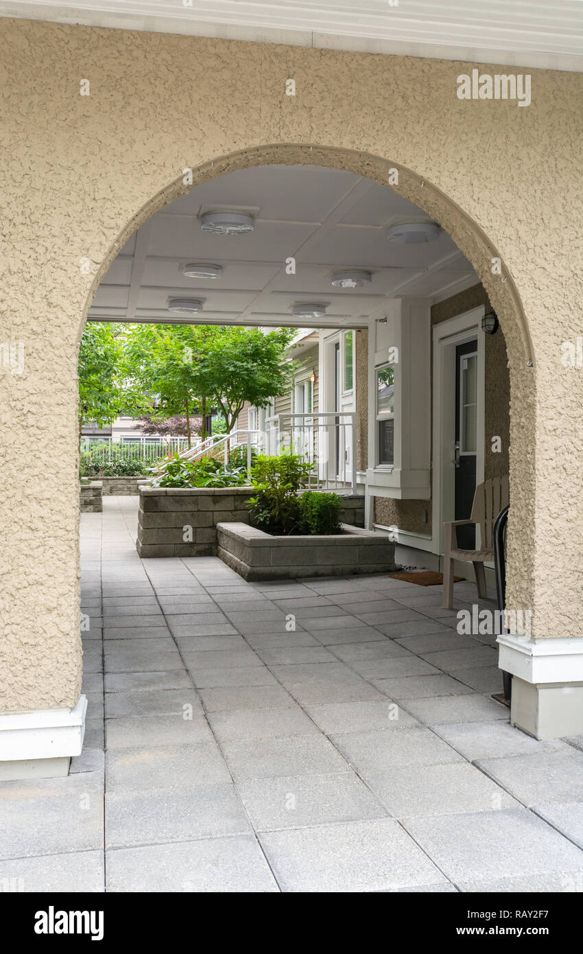 Entrance arch to inner yard of residential complex Stock Photo - Alamy