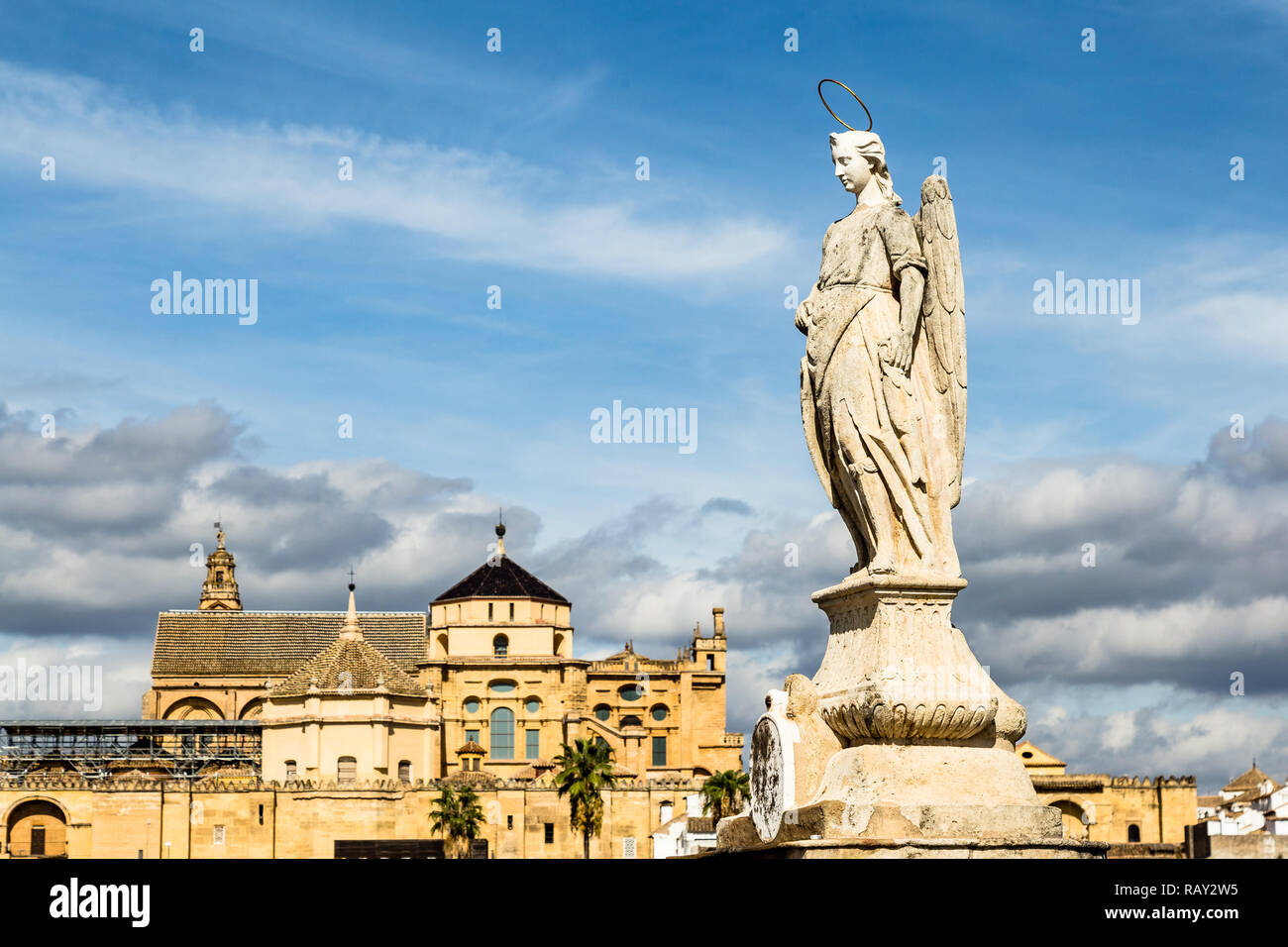 View of Mezquita, Catedral de Cordoba behind an angel statue on the ...