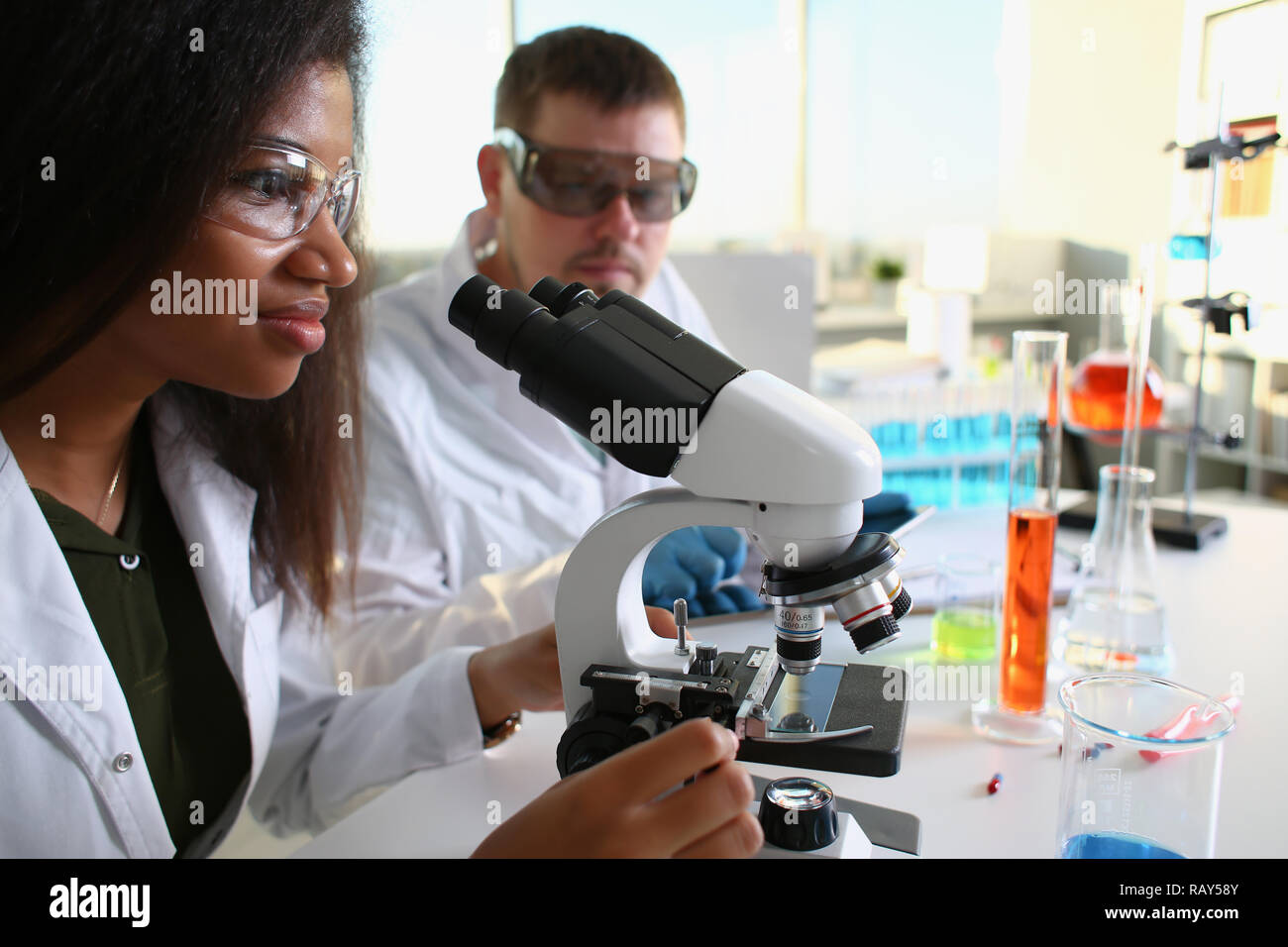 Two scientists of a student chemist are conducting Stock Photo - Alamy