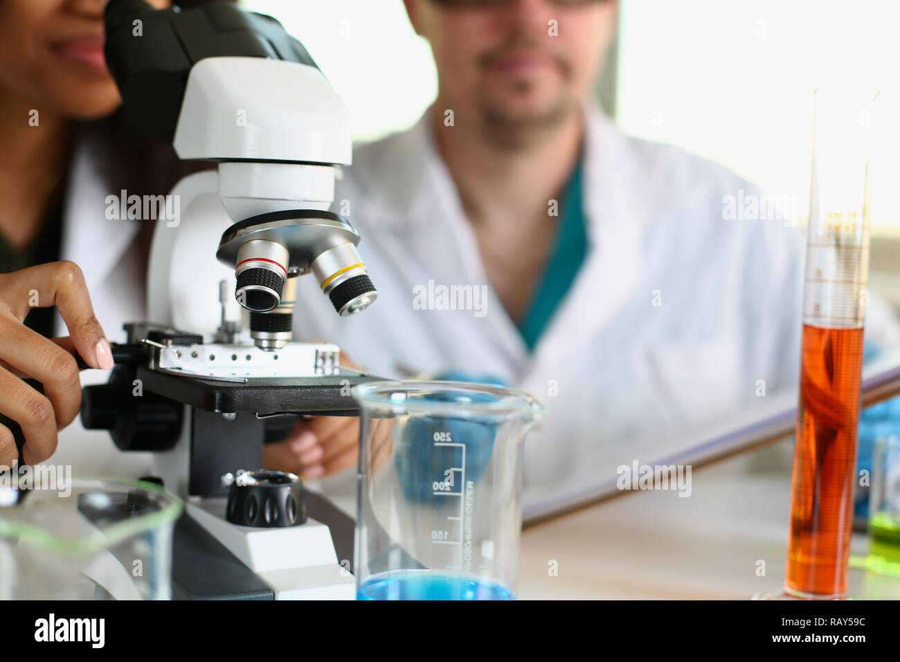 Two scientists of a student chemist are conducting Stock Photo - Alamy