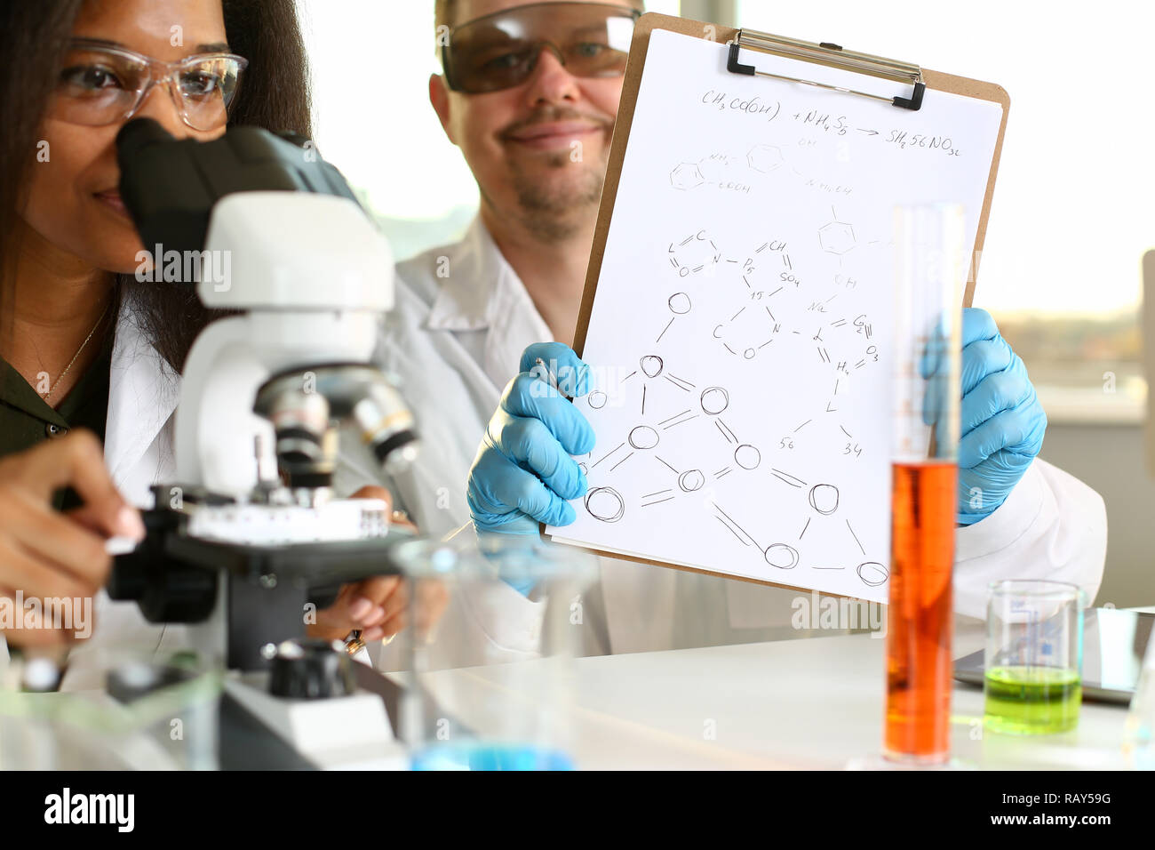 Two scientists of a student chemist are conducting Stock Photo - Alamy
