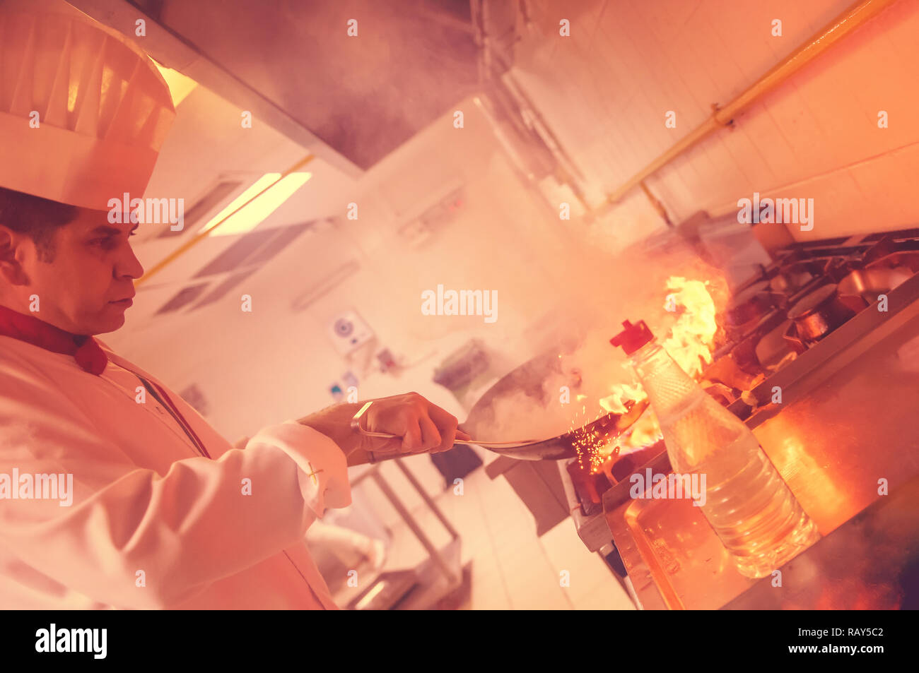 Cook working flaming pan hi-res stock photography and images - Alamy