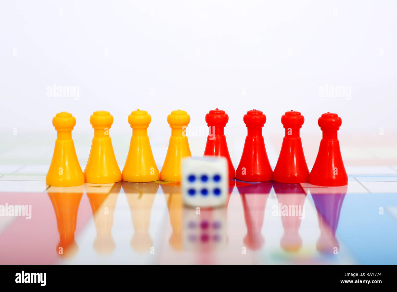 Picture of red and yellow tokens with dice on the ludo board game Stock ...