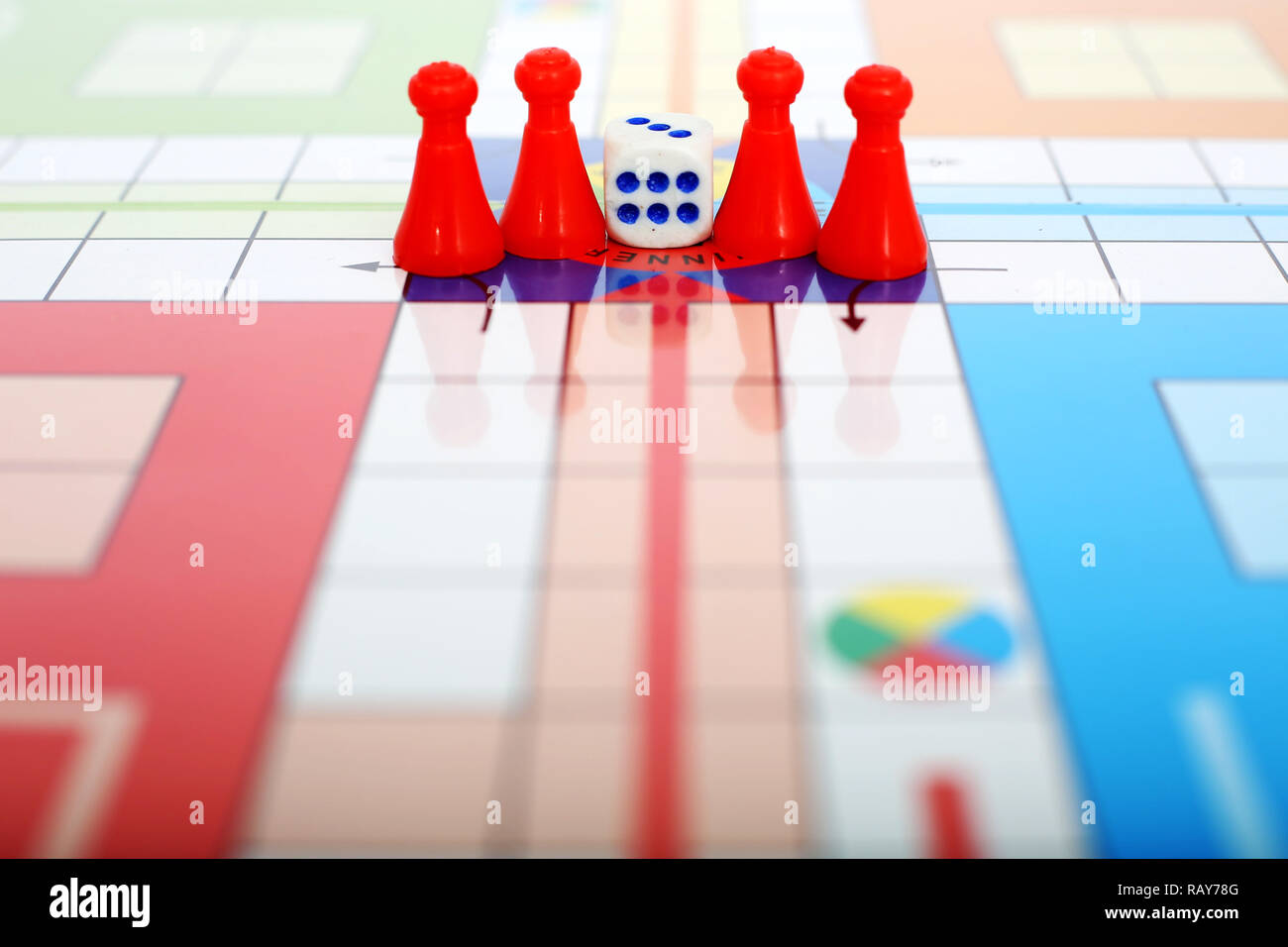 Picture of red tokens with dice on the ludo game Stock Photo - Alamy