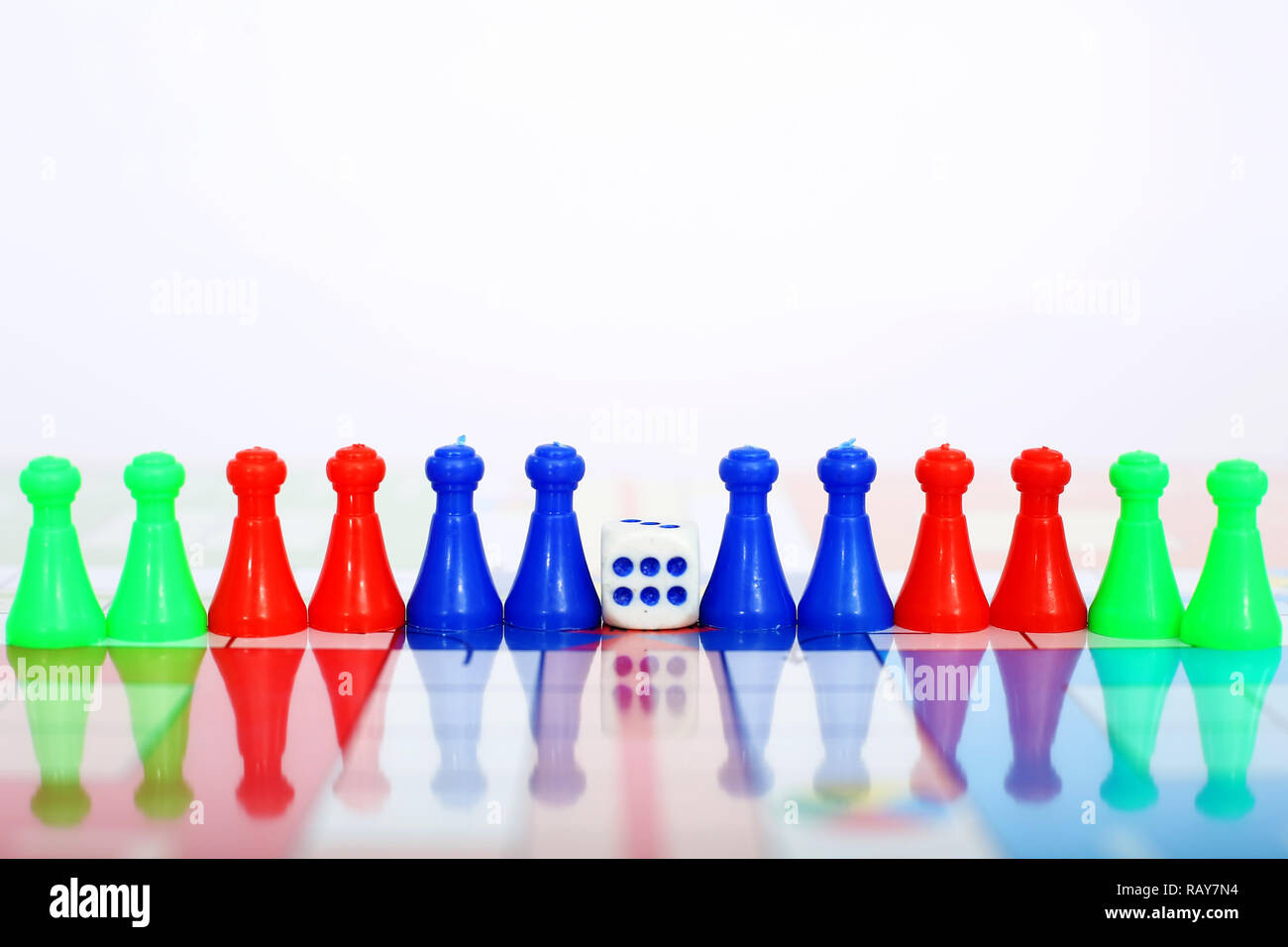 Picture of different color tokens with dice Stock Photo - Alamy