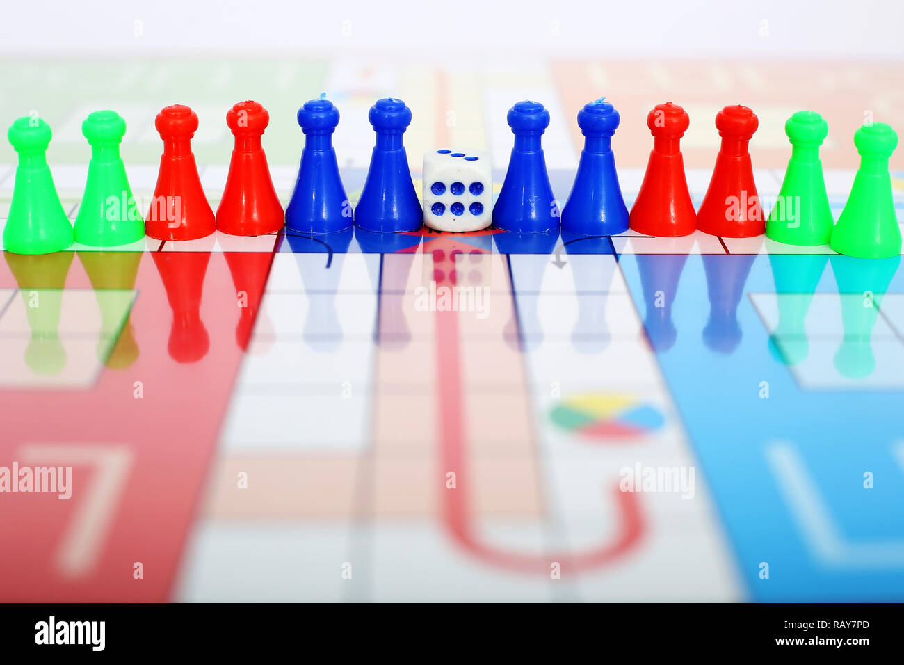 Picture of different color tokens with dice Stock Photo - Alamy