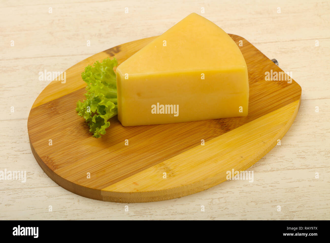 Parmesan cheese triangle Stock Photo - Alamy